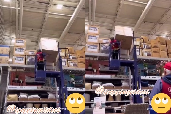 A Man Cries Out As He Struggles With Merchandise On Order Picker Equipment